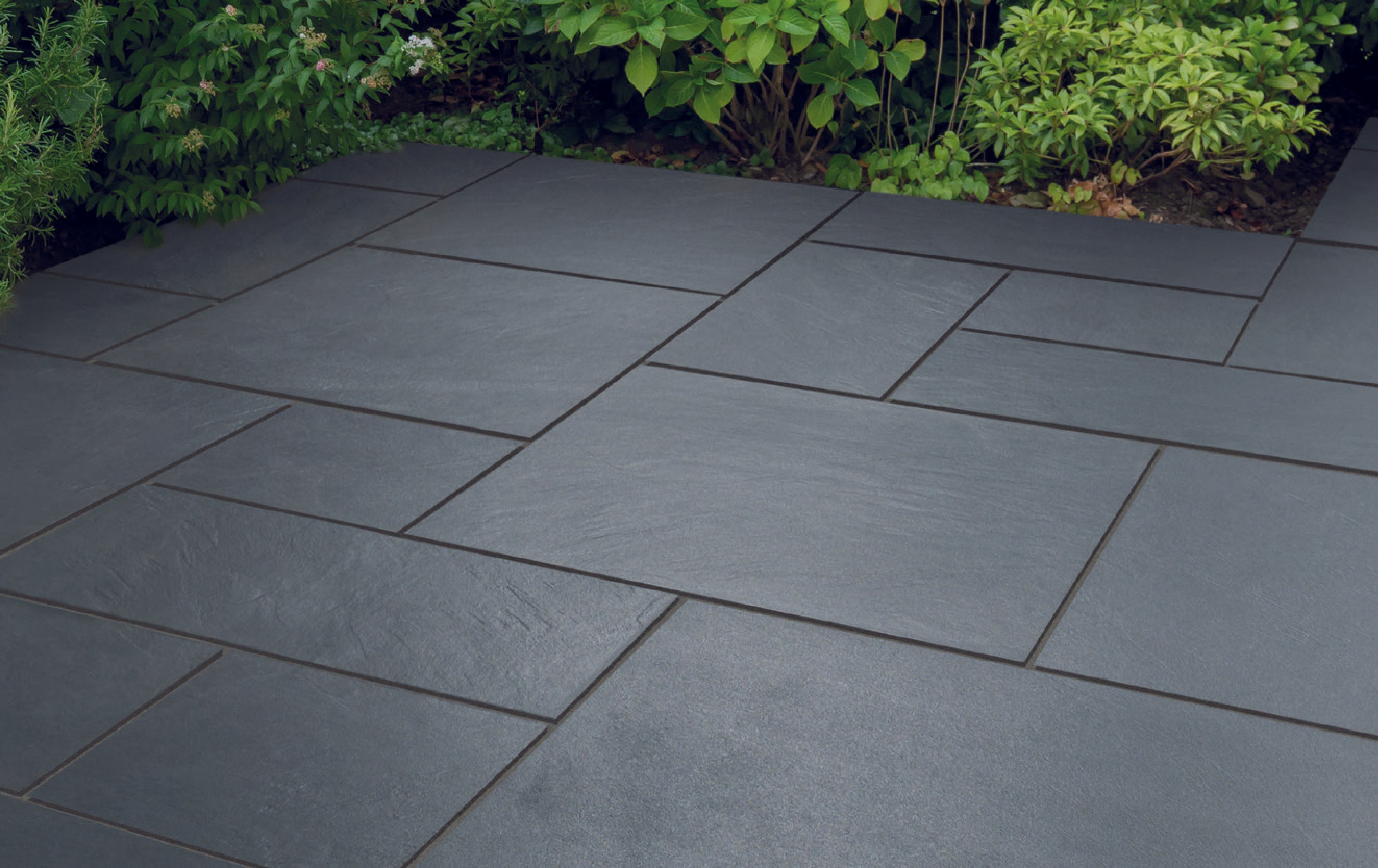 Bradstone Rock Porcelain Paving In Blue Black | Slade's Garden and ...